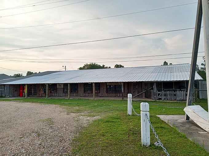 The rustic charm of Dedeaux Furniture provides the perfect backdrop for its gigantic wooden mascot.