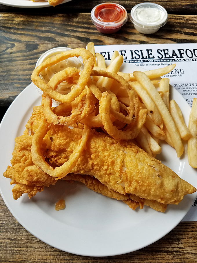 Golden-battered fish and crispy onion rings that could make a New Englander weep with joy. The perfect marriage of crunch and tenderness on a no-nonsense white plate.