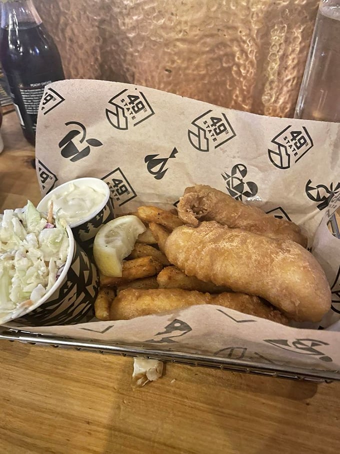 Golden-battered halibut that shatters with each bite, paired with crispy fries and creamy slaw&mdash;comfort food elevated to art.