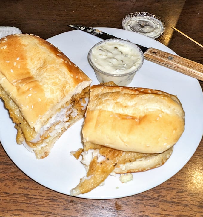 Behold the star attraction! This flounder sandwich extends beyond its bun with golden-fried perfection that makes fish sandwich connoisseurs weak in the knees.