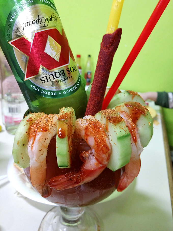 This isn't just a drink &ndash; it's an architectural achievement of shrimp, cucumber, and spice balanced atop a michelada. Liquid lunch, elevated.