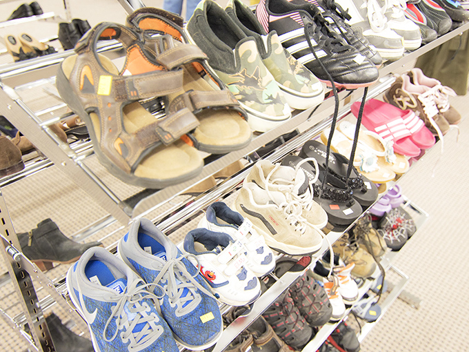 Footwear with stories to tell: these shelves hold everything from barely-worn sneakers to sandals that might have walked interesting paths before yours.