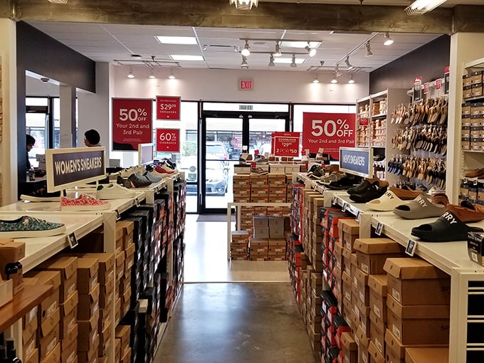 Rows of discounted shoes waiting to solve your footwear dilemmas without emptying your retirement fund completely.