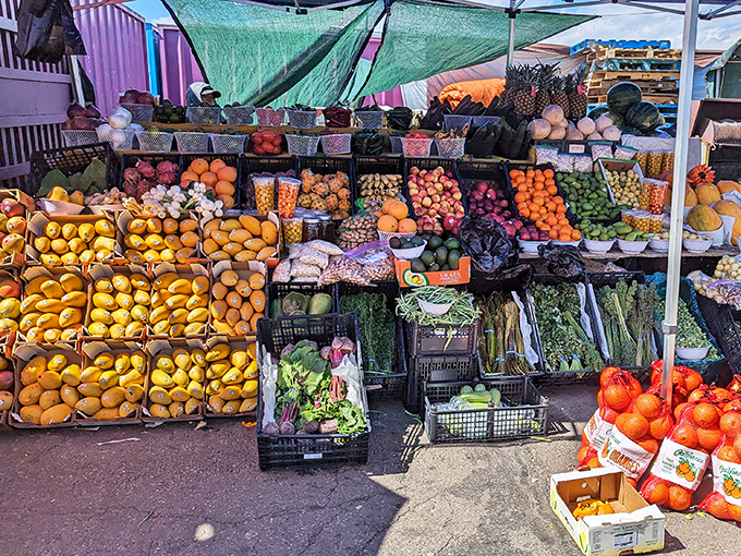 Nature's candy store! This produce stand bursts with such vibrant colors it makes the vegetable aisle at your supermarket look like it's filming in black and white.