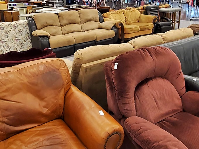 Couches huddle together like old friends at a reunion, each with stories to tell and comfort still to give.