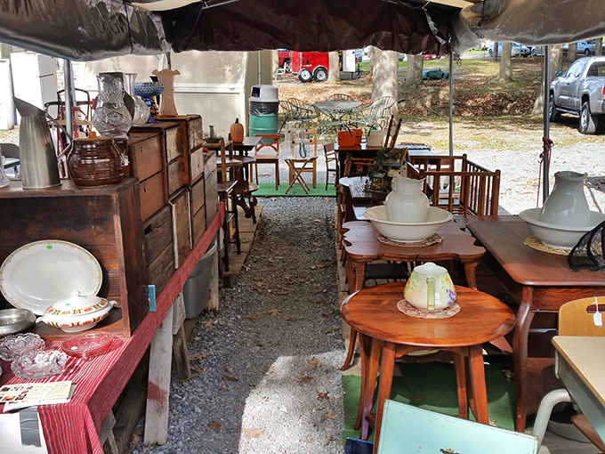 Step inside this canvas-covered time capsule where furniture from five different decades creates an impromptu living room under the sky.