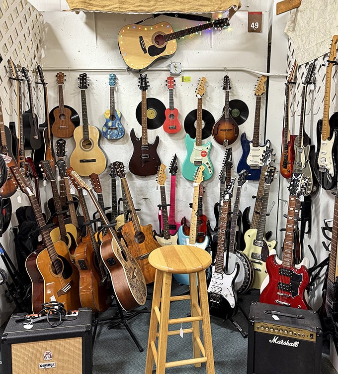 Guitar heaven! Acoustic, electric, vintage, and modern instruments create a silent symphony of possibilities. Musicians could spend hours strumming through decades of musical history.