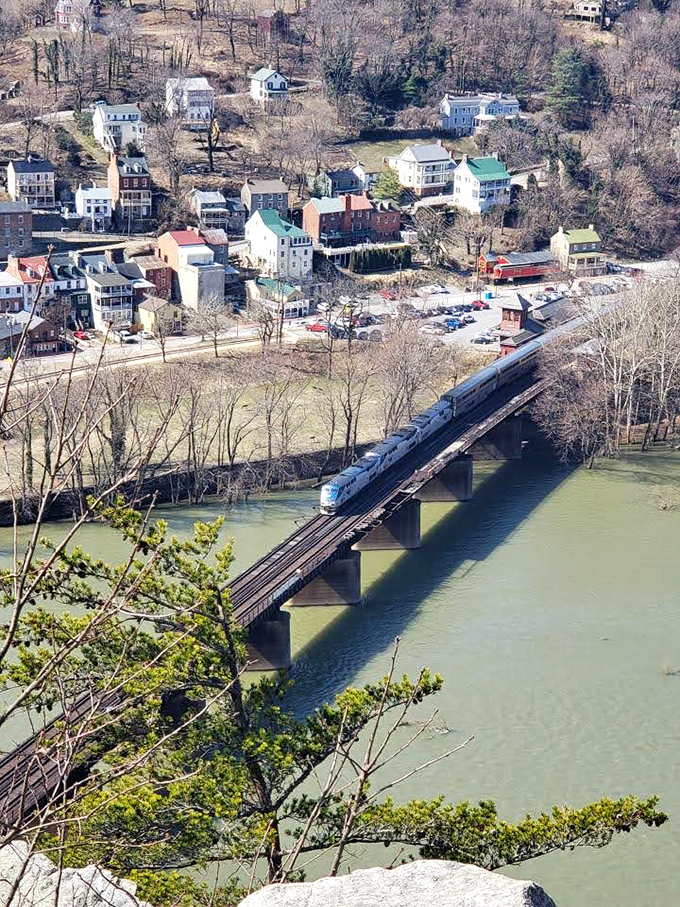 Harpers Ferry reveals its historic bones, with a passenger train gliding across the river like a time traveler connecting past and present.