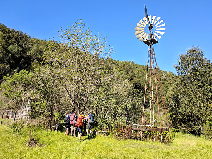 Old-school windmill meets modern-day hikers. The past and present converge on trails that have stories to tell.