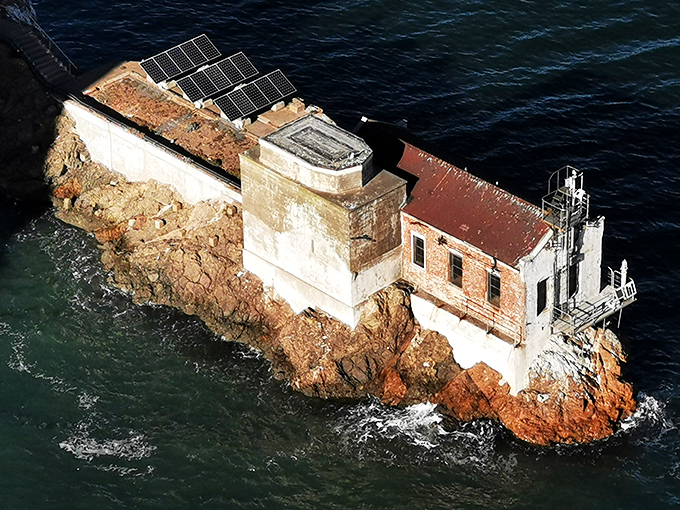 This lonely lighthouse stands guard at the bay's edge, a stoic sentinel that's seen more San Francisco fog than Karl the Fog himself.