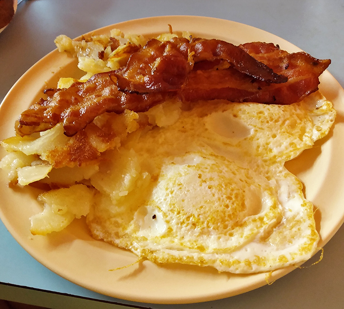Breakfast perfection doesn't need to be complicated. Perfectly fried eggs, crispy bacon, and home fries that make you question all other potatoes.