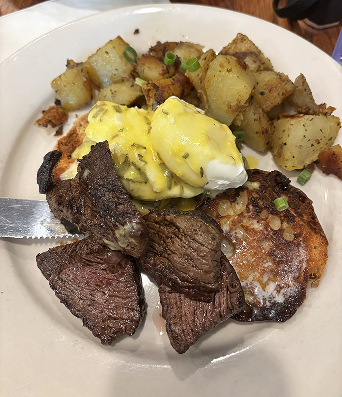Steak and eggs reimagined&mdash;perfectly seared beef alongside golden potatoes and hollandaise-draped poached eggs that make Monday mornings bearable again.