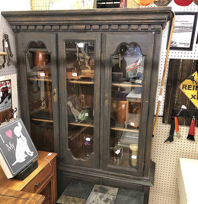 This isn't just furniture – it's time travel. This distinguished hutch has probably witnessed more family dinners than most of us have had hot breakfasts.