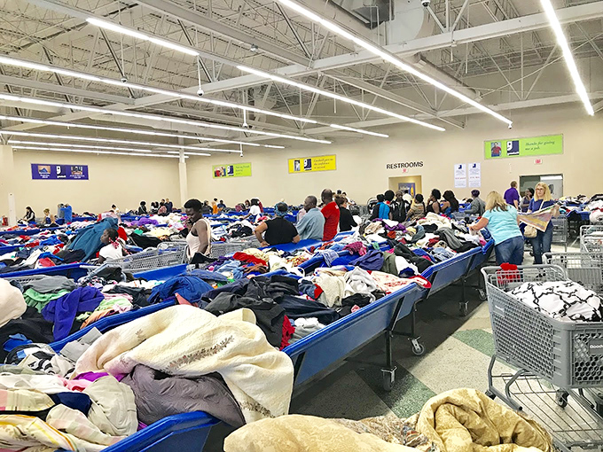 The archaeological dig of retail therapy. Shoppers sift through layers of textiles like paleontologists uncovering fashion fossils from seasons past.