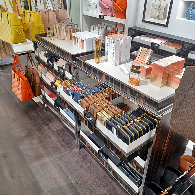 Designer handbags arranged like artwork, making you feel fancy while actually being smart about your spending habits for once.