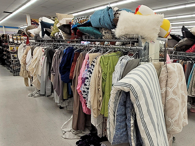 The bedding section: where yesterday's luxury linens find tomorrow's guest rooms, piled high with possibility.