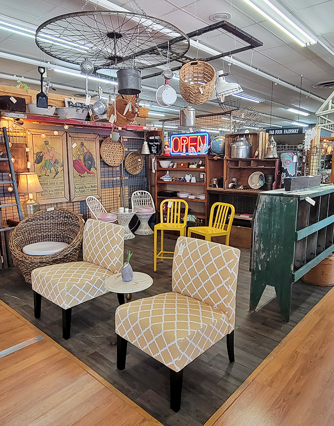 Mid-century modern meets eclectic charm in this vignette. Those yellow chairs are practically screaming, "Hey, the 1960s called and they're jealous you found us!"