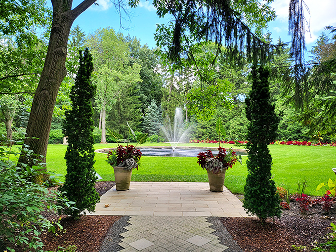Emerald sentinels stand guard as a fountain dances in the distance. The perfect spot to pretend you've suddenly inherited a country estate.