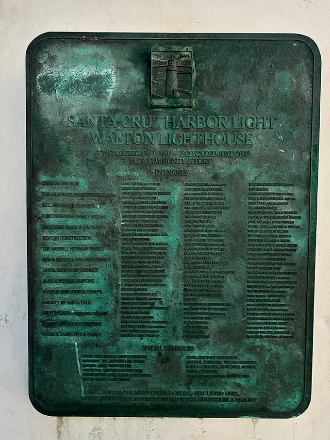 History cast in bronze tells the lighthouse's origin story. Like reading the credits of a movie where the ocean is the star.