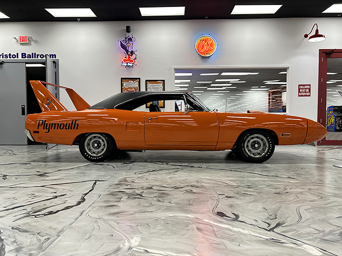 The Plymouth Superbird's massive rear wing isn't compensating for anything &ndash; it's announcing "physics is just a suggestion" in bright Vitamin C orange.