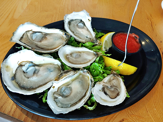 These oysters aren't just served; they're presented&mdash;plump, pristine treasures nestled in their shells like nature's perfect appetizer.