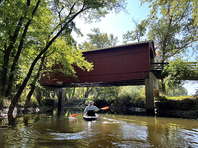 Some explore by car, others by foot. The adventurous? They paddle beneath this historic landmark, gaining a whole new perspective.