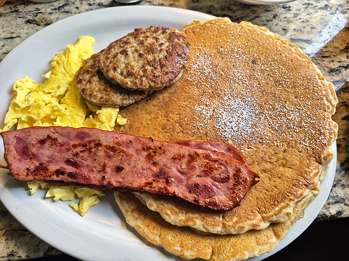 Pancake perfection doesn't need to be complicated. Golden discs with sausage and eggs that would make your grandmother nod in approval.
