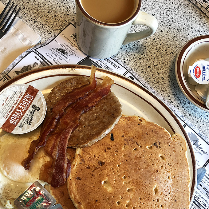 Pancakes that don't need to shout for attention. Golden-brown, fluffy, and ready for their maple syrup baptism&mdash;breakfast perfection on a plate.