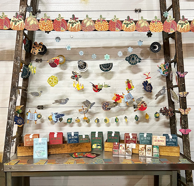 Seasonal whimsy dangles from vintage ladders, where handcrafted garlands and festive ornaments await their next celebration.