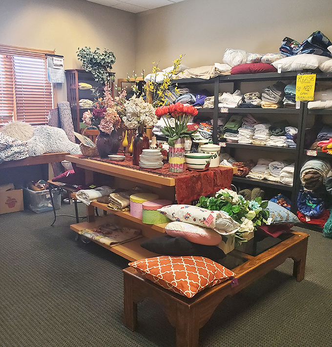 Textile treasures stacked with care&mdash;someone's discarded duvet cover might become your reading nook's perfect finishing touch.