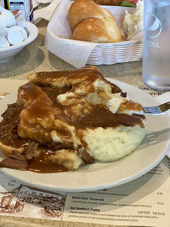 Now, that's a pile of comfort! Savory pot roast and mashed potatoes, absolutely drenched in rich, homemade brown gravy.