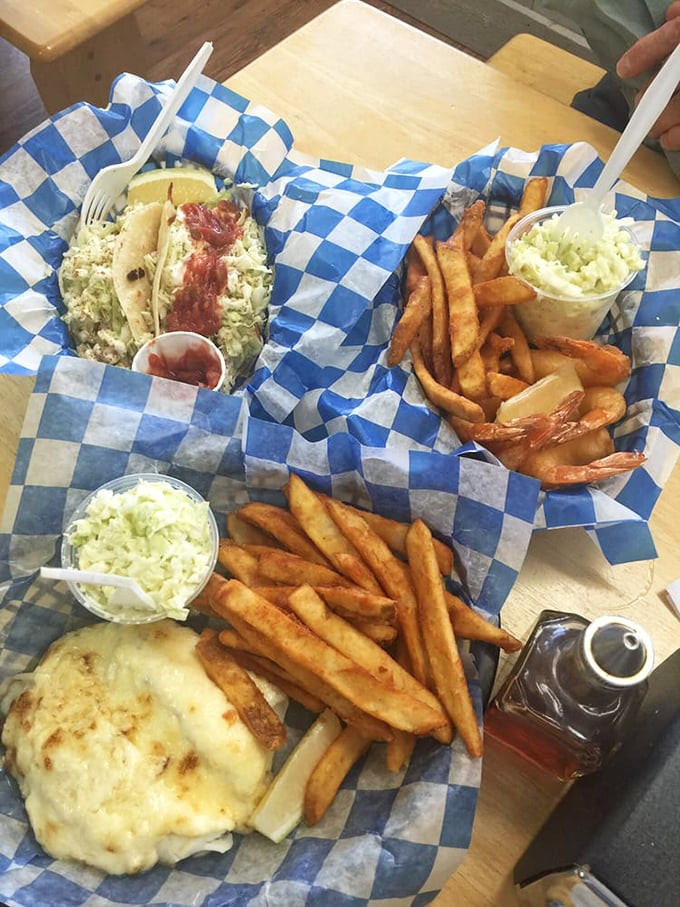 A feast fit for Neptune himself&mdash;tacos, fried seafood, and fresh slaw create a blue-checkered tableau that screams "vacation" even in landlocked territory.