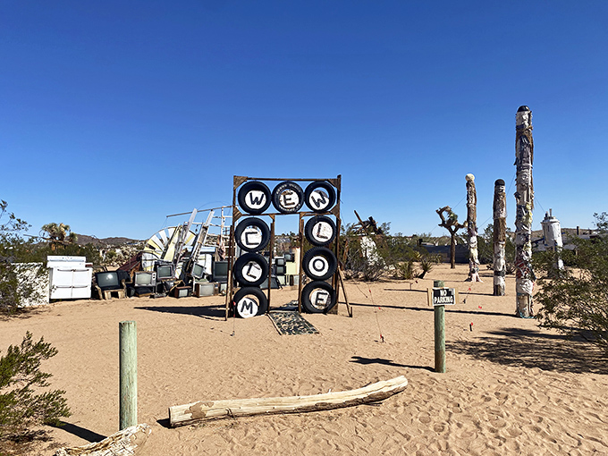 "WELCOME" spelled out in tires &ndash; because nothing says desert hospitality like rubber that's finally found its retirement home.