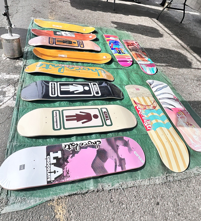 Skateboard decks laid out like modern art pieces, each a canvas of self-expression waiting for the right rider to come along.