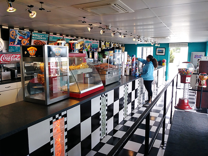 Black and white checkered floors meet turquoise walls&mdash;this snack bar is serving serious retro vibes with your nachos.