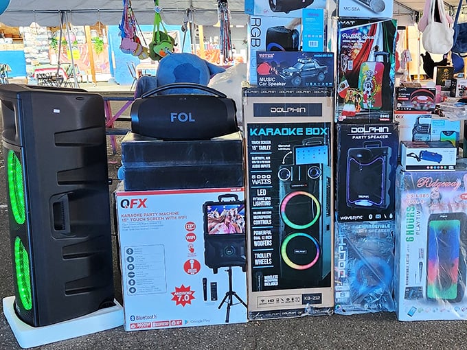 Modern karaoke machines and speakers line this tech vendor's space&mdash;proof that yesterday's luxury items become today's swap meet bargains.