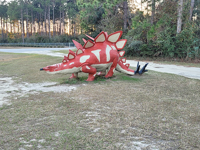 The stegosaurus didn't get the "natural camouflage" memo. Its vibrant red plates stand out like a Cardinals fan at an Auburn game.