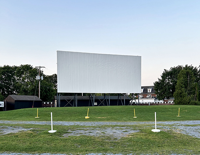 The blank canvas before showtime, standing tall against Pennsylvania skies. Soon it'll transform into a 30-foot window to other worlds.