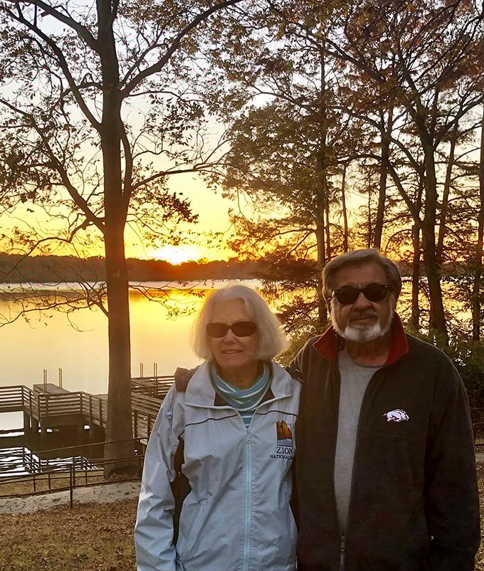 Golden hour at Lake Chicot transforms visitors into silhouettes against a canvas of amber and gold. Even amateur photographers look like professionals here.