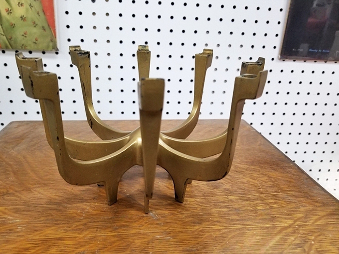 Mid-century modern meets ancient altar in this brass candelabra. Don Draper would've displayed this proudly while mixing Old Fashioneds for impressed dinner guests.