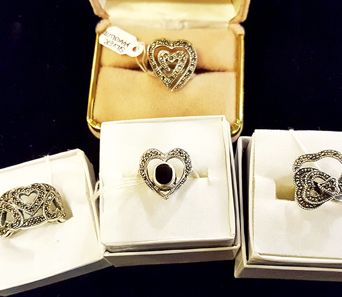 Heart-shaped vintage rings that whisper tales of romance from another era. Someone's grandmother probably received one of these while Glenn Miller played in the background.