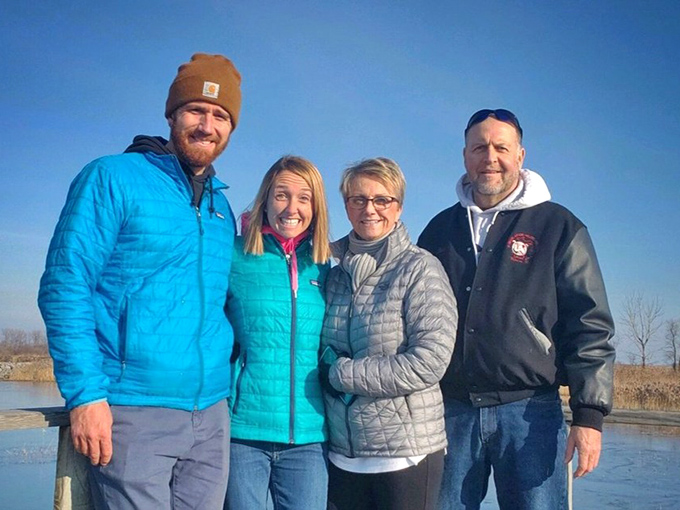 Visitors bundled against winter winds share laughs by the water. Some friendships, like the best state parks, only get better with seasonal changes.