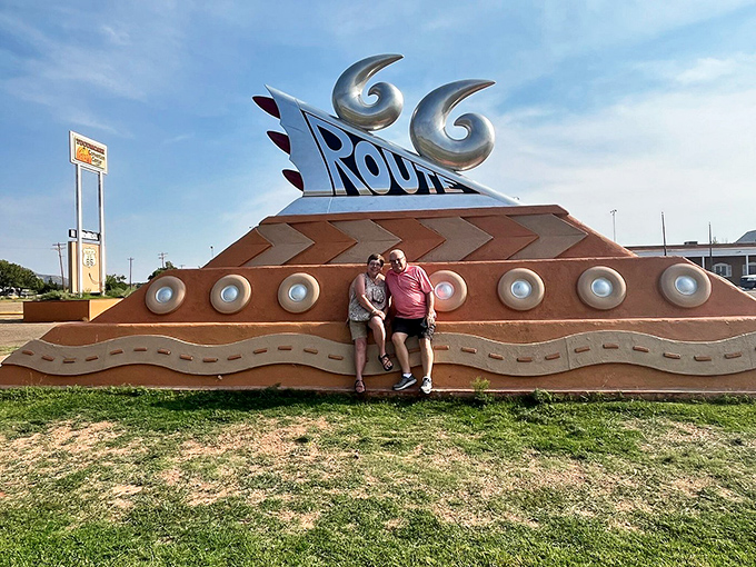 Roadside memories in the making&mdash;visitors pose with the monument that's become Tucumcari's most photographed landmark.