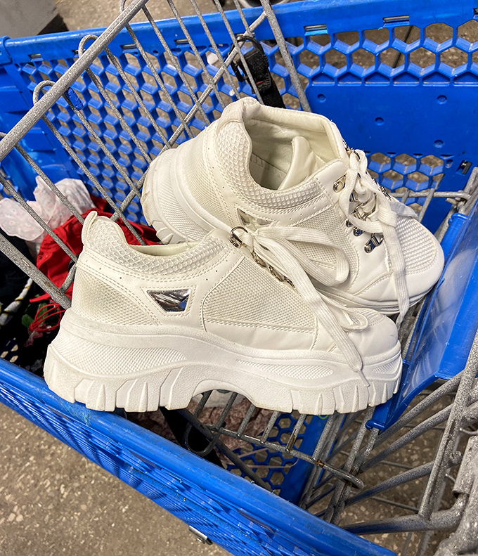 Platform sneakers that scream "Y2K revival" nestled in a blue bin. Someone's fashion regret becomes another's vintage street cred.