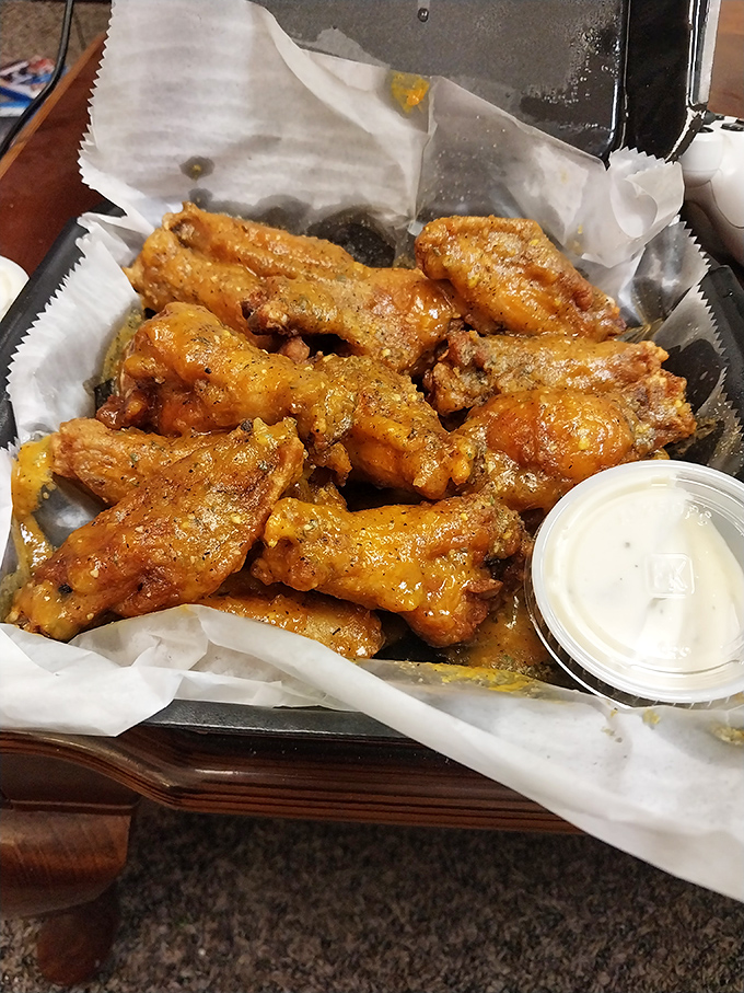These wings aren't just cooked&mdash;they're transformed into glistening, sauce-slathered works of art that make you question why you ever bothered with boneless.