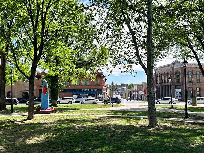 The town plaza creates community gathering space where actual humans still congregate outdoors instead of just scrolling through their phones indoors.