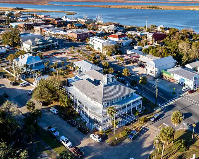 Apalachicola's waterfront view showcases the perfect marriage of working harbor and vacation paradise, where seafood goes from boat to plate in record time.
