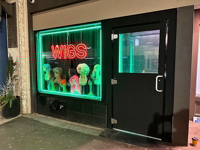 Behind this neon "WIGS" sign lies Boston's most delicious secret. Speakeasy steaks worth whispering about!