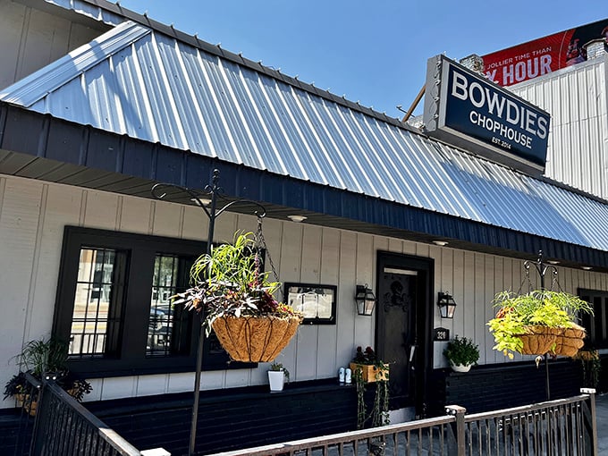 Bowdie's Chophouse keeps it real with its no-nonsense exterior. The metal roof protects something precious - perfectly cooked beef.