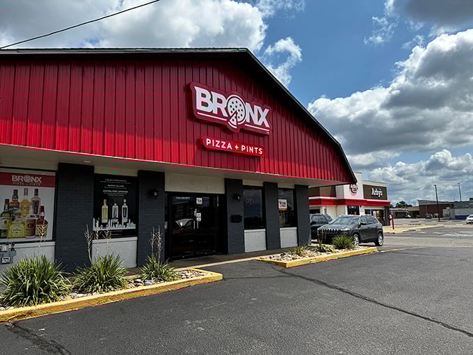 That barn-red exterior isn't just eye-catching&mdash;it's a beacon of pizza perfection. The "Pizza + Pints" promise is one they definitely keep!